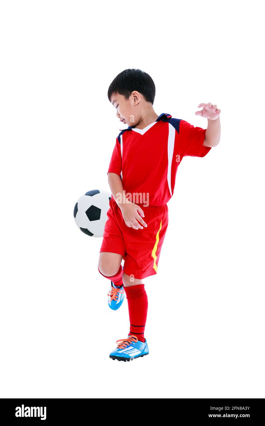 Full length portrait of happy asian soccer player in red uniform ...