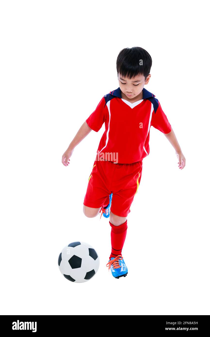 Full length portrait of happy asian soccer player in red uniform ...