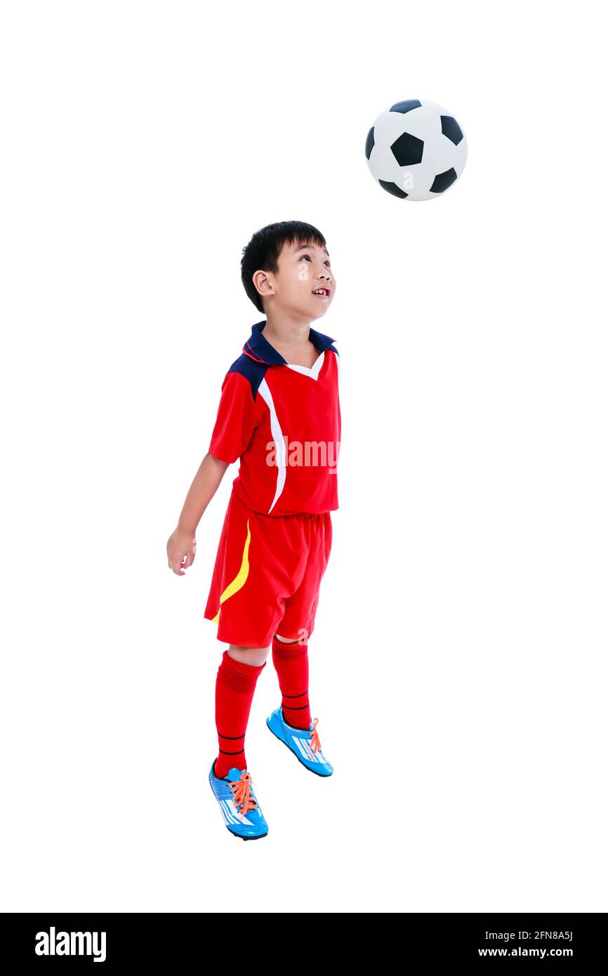 Full length portrait of happy asian soccer player in red uniform ...