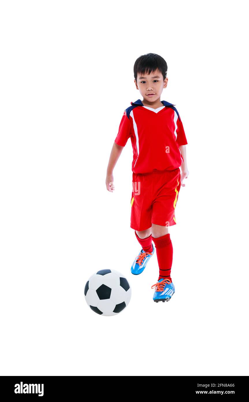 Full length portrait of happy asian soccer player in red uniform ...