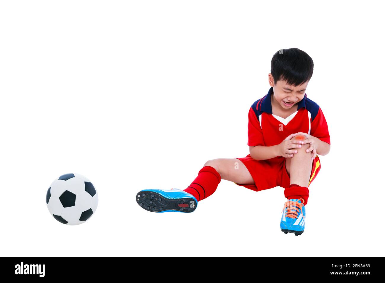 Sports injure. Full body of youth asian soccer player with football in ...