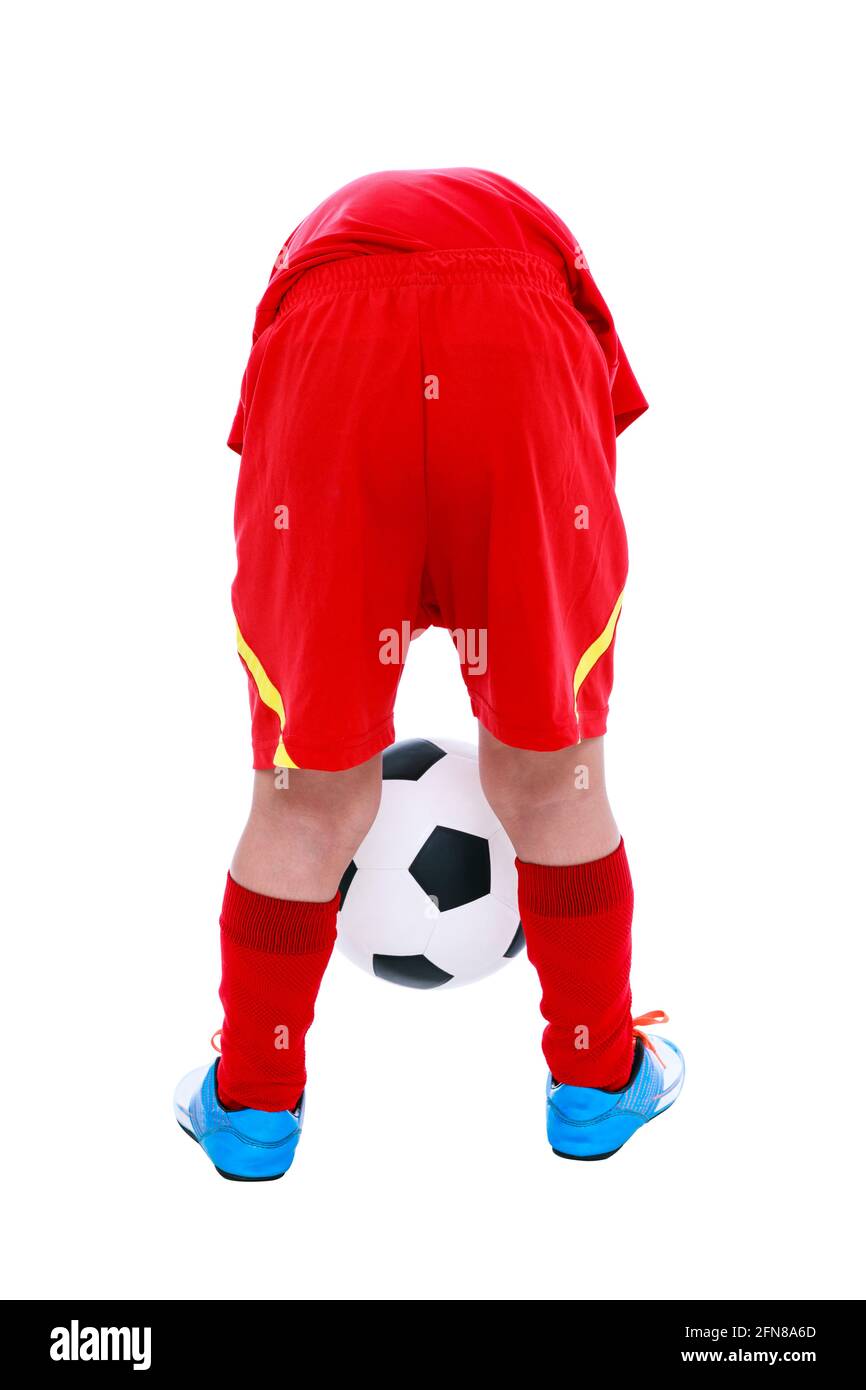 Back view of asian soccer player in red uniform holding his soccer ball ...