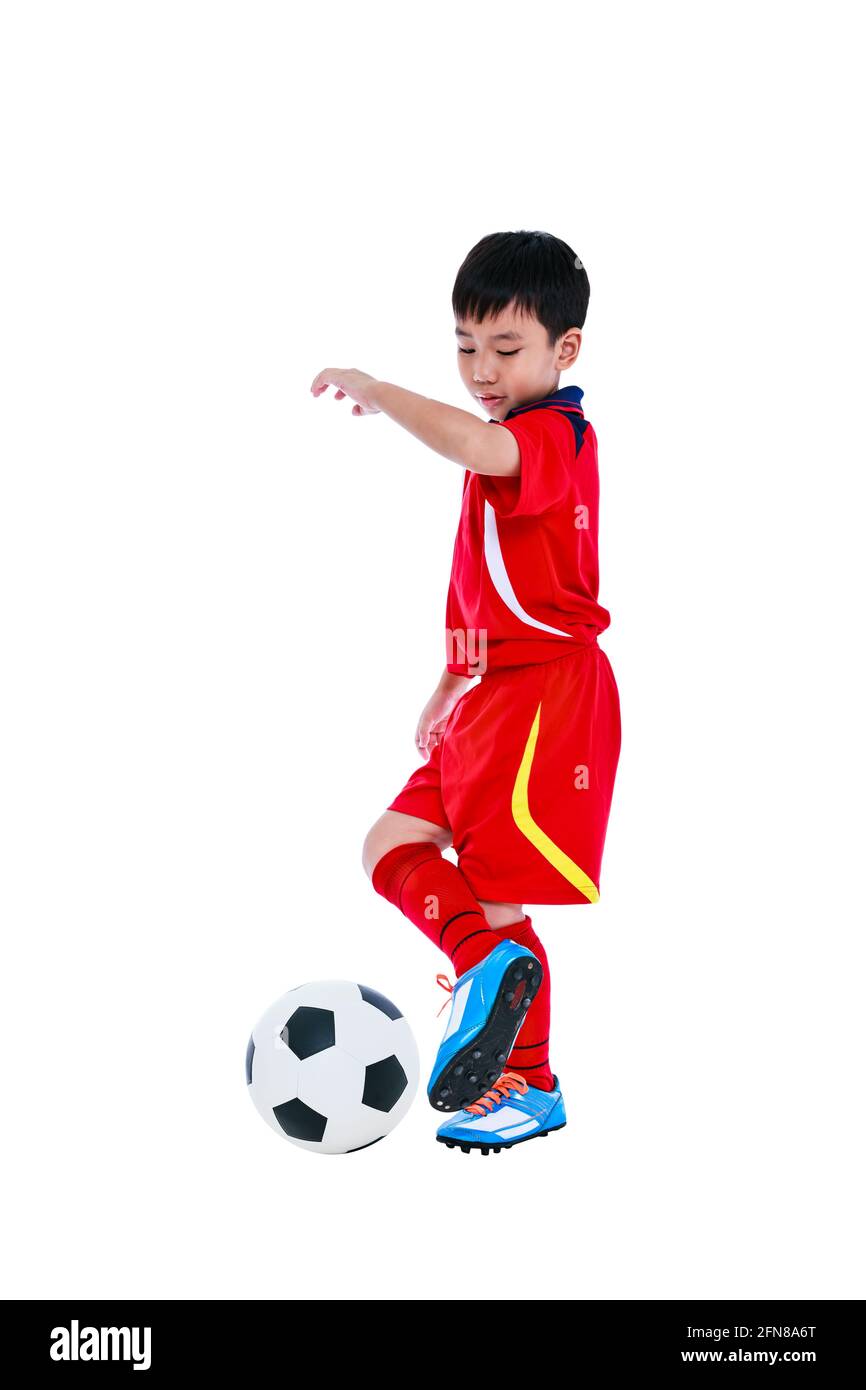 Full length portrait of happy asian soccer player in red uniform ...