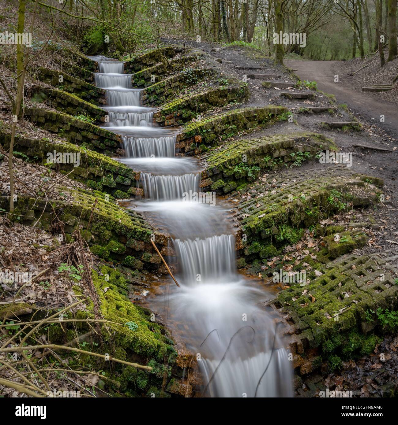 A manmade waterfall in Haigh Woodlands Park, Haigh Plantations, Wigan ...