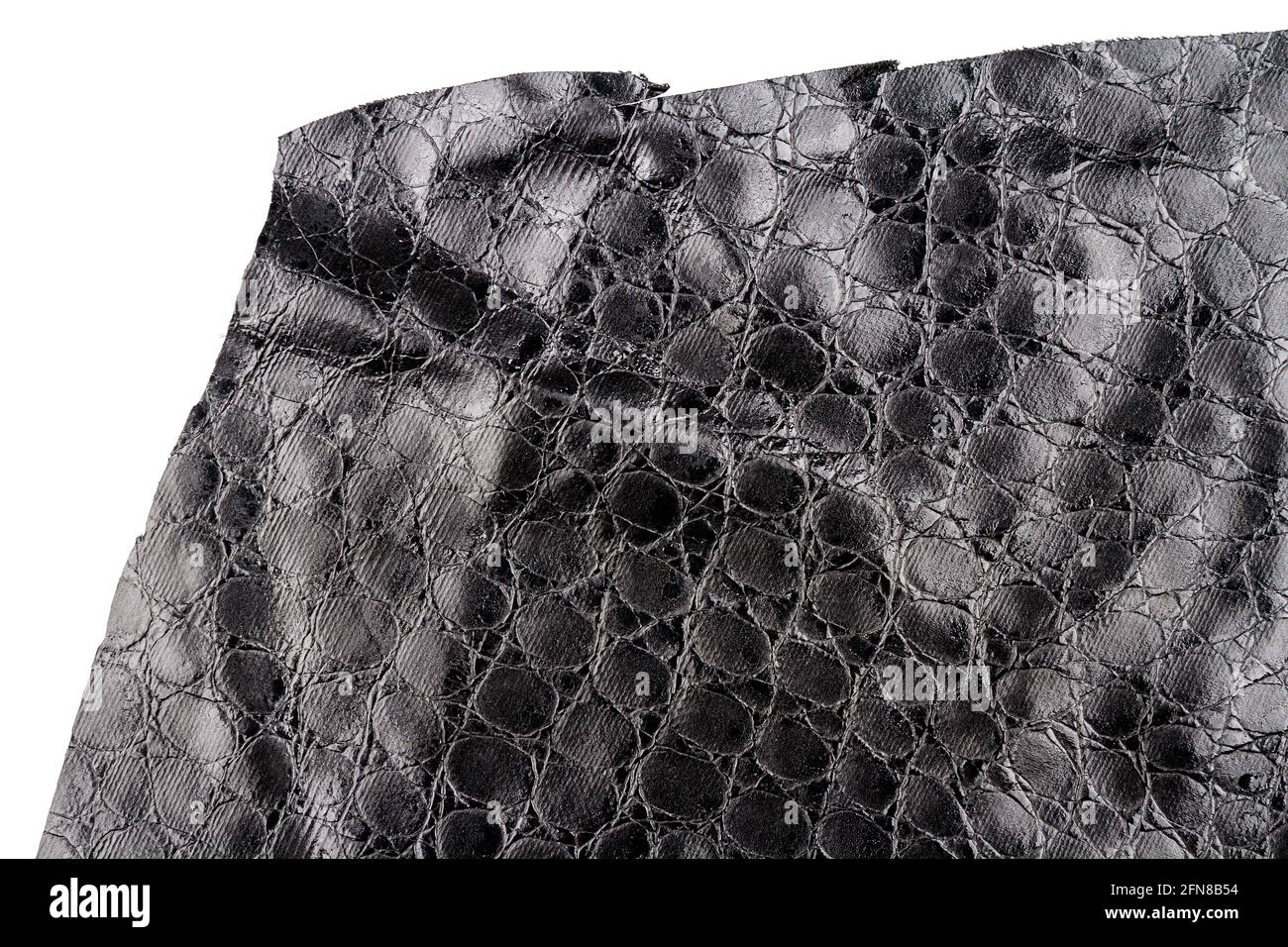 Piece of black artificial leather isolated on white background. Fake ...
