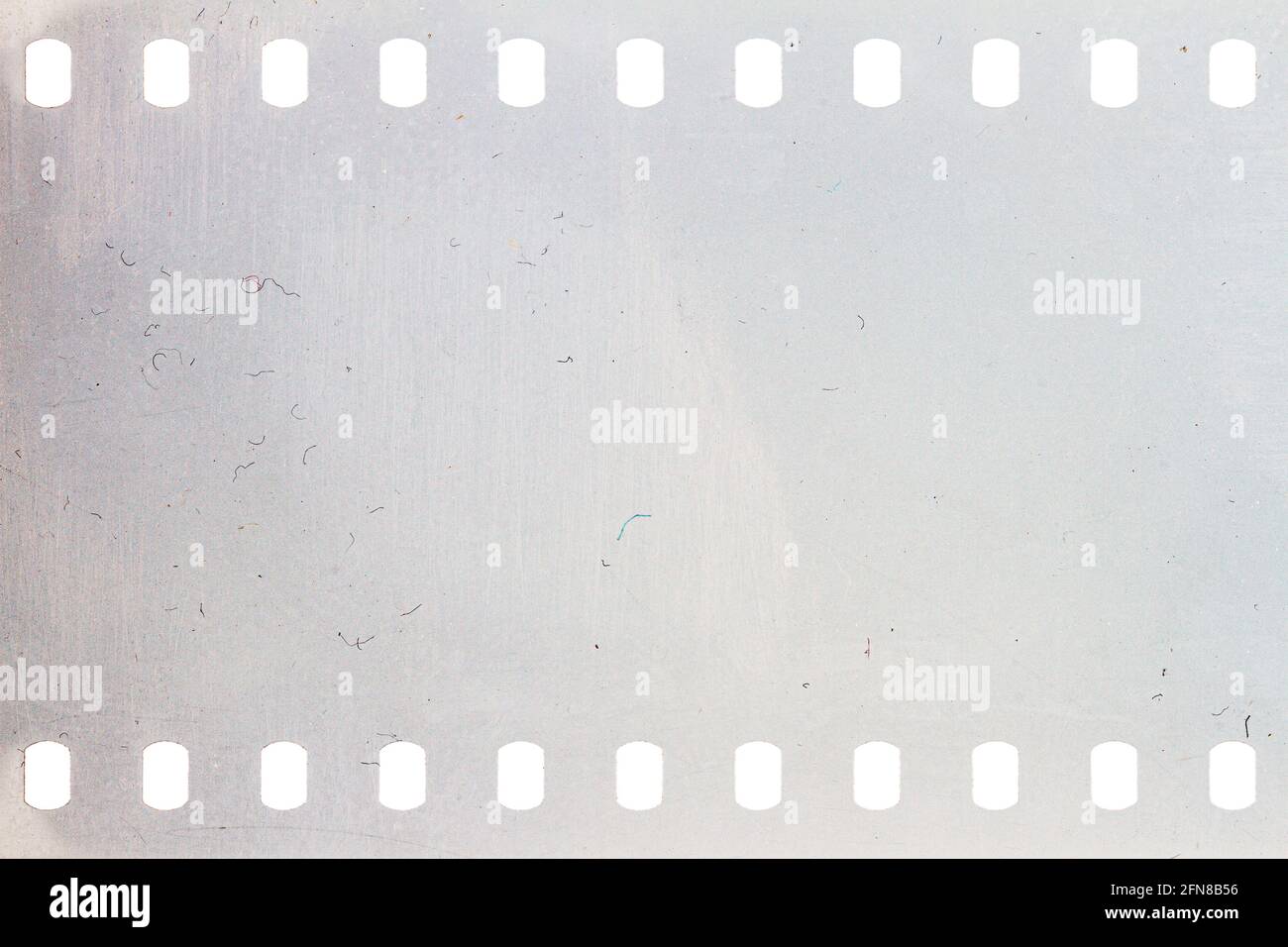 Dusty and grungy 35mm film texture or surface. Perforated camera film ...