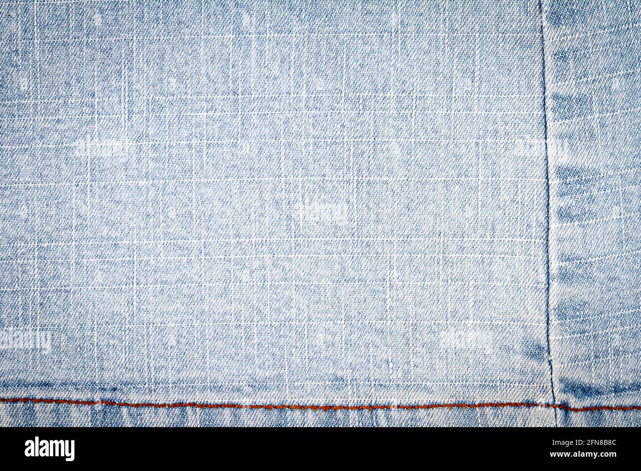 Light blue jeans texture. Denim fabric background with a seam Stock ...