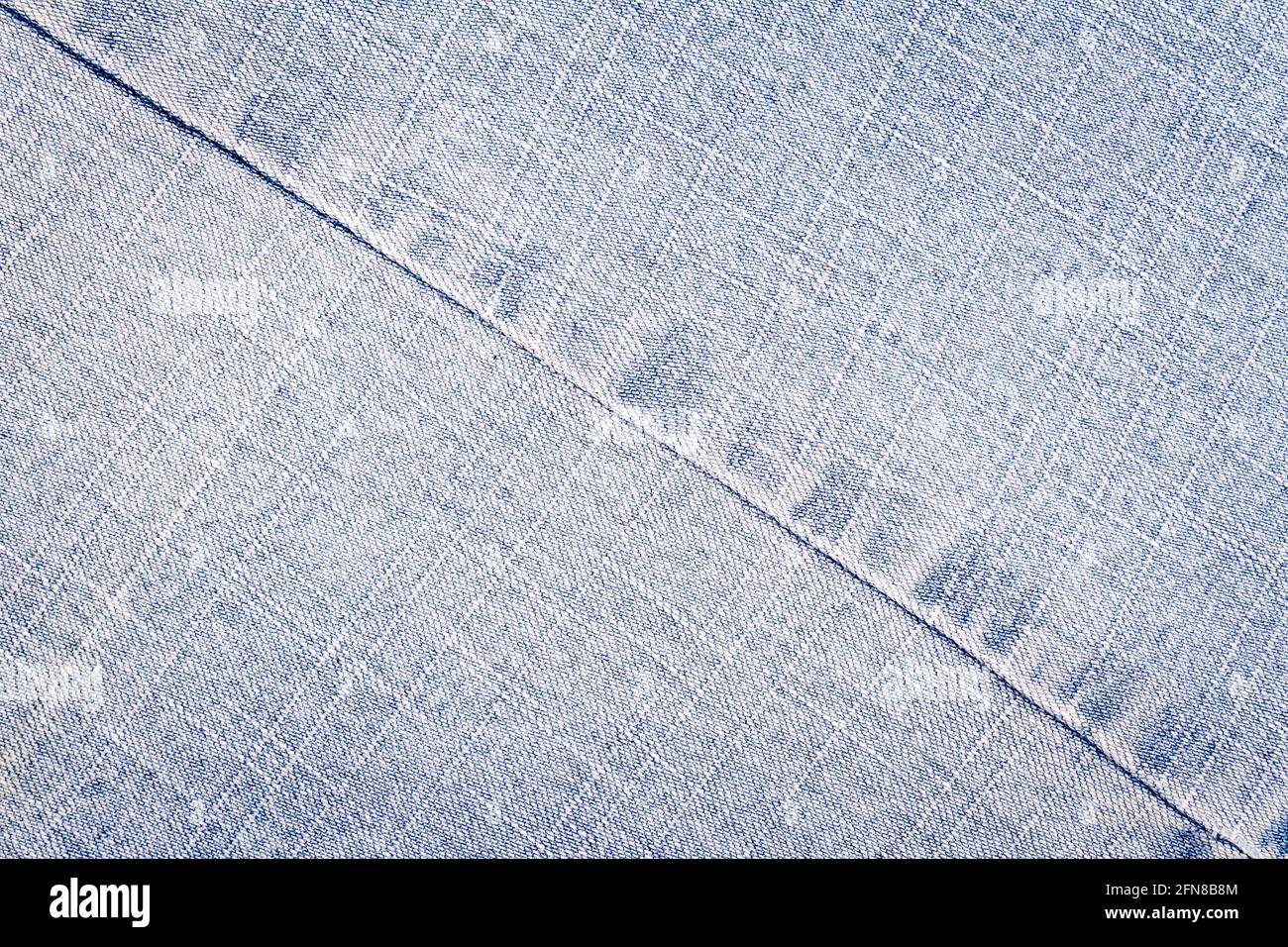 Light blue jeans texture. Denim fabric background with a seam Stock ...