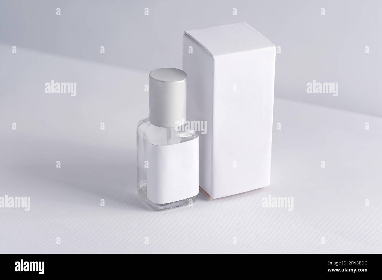 glass product package Perfume bottle and white gift box Stock Photo - Alamy