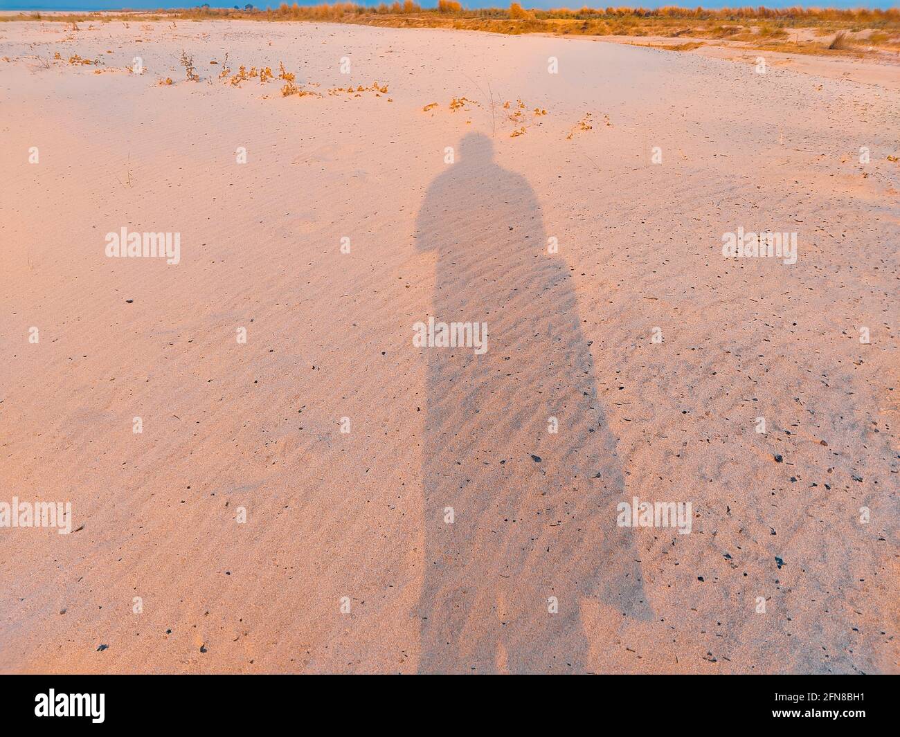 A shadow in sand desert with sky background Stock Photo - Alamy