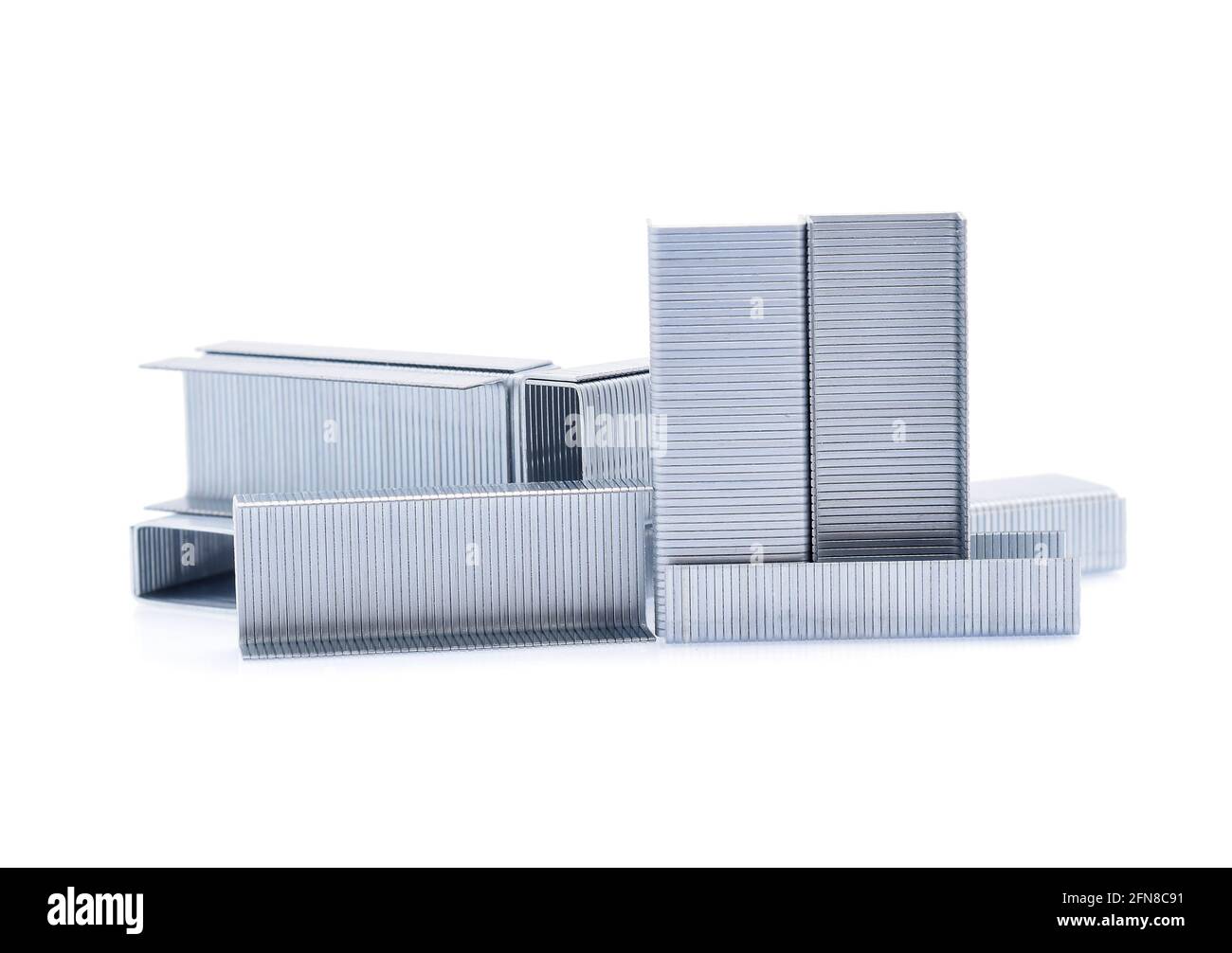 Stack of metal staples isolated on white background Stock Photo - Alamy