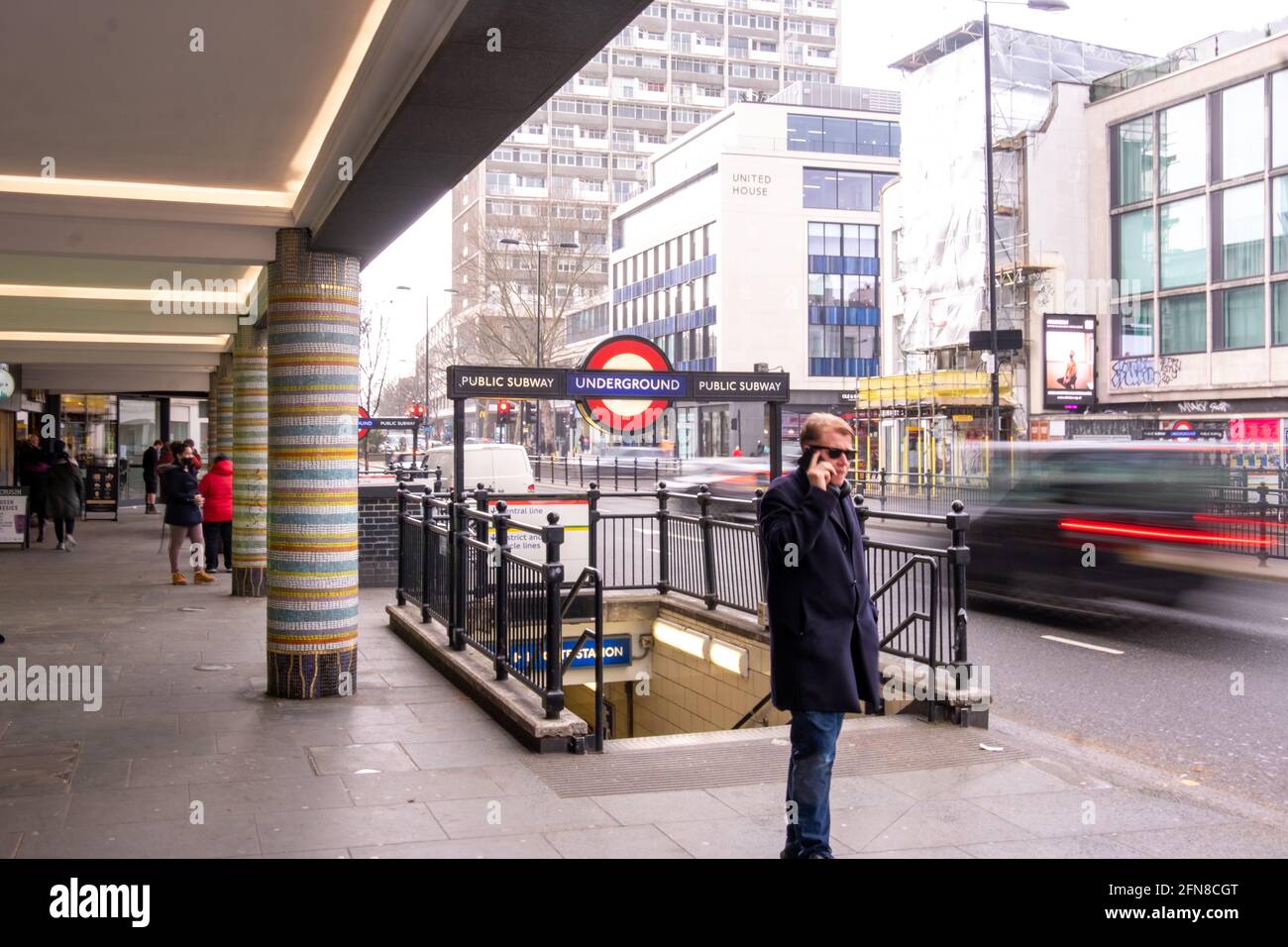 London, May 2021: Notting Hill Gate high street and Underground station ...