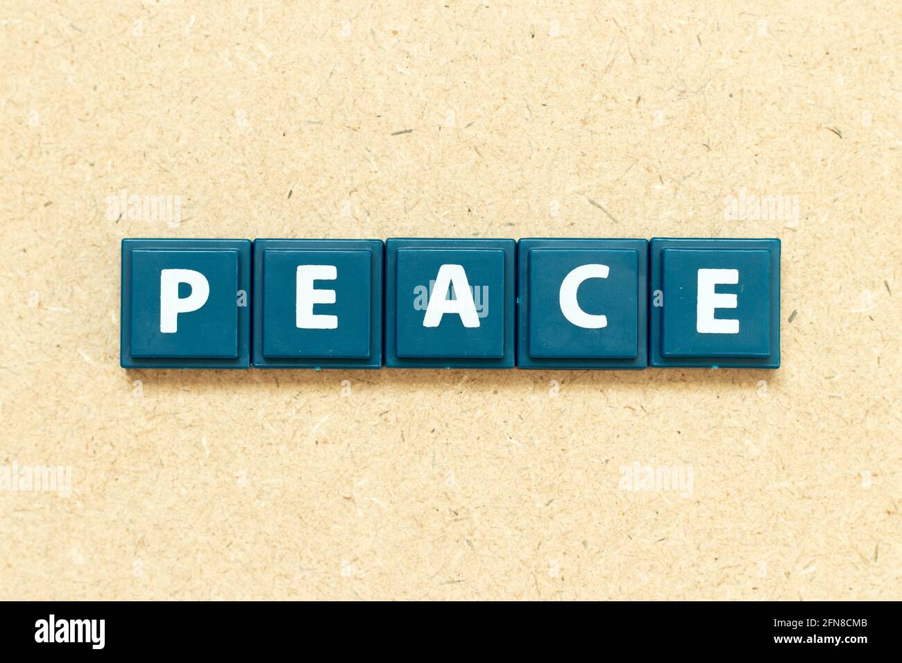 Tile alphabet letter in word peace on wood background Stock Photo - Alamy