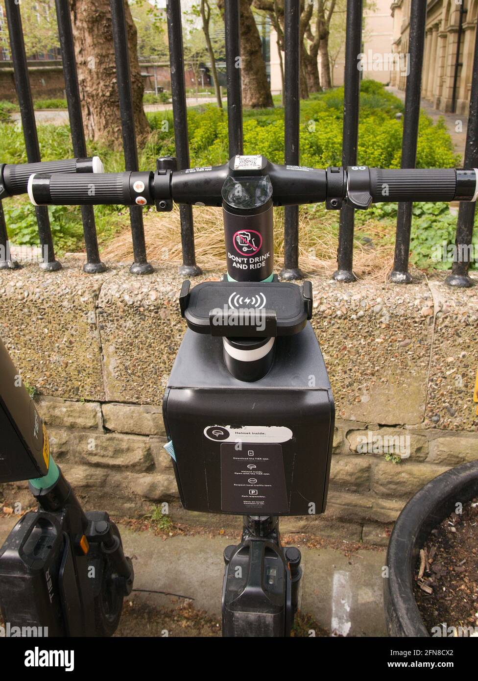 Closeup of an escooter steering column and phone mount Stock Photo - Alamy