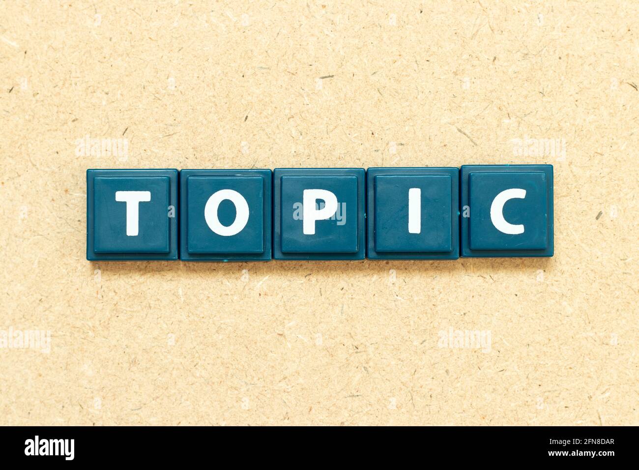 Tile alphabet letter in word topic on wood background Stock Photo - Alamy