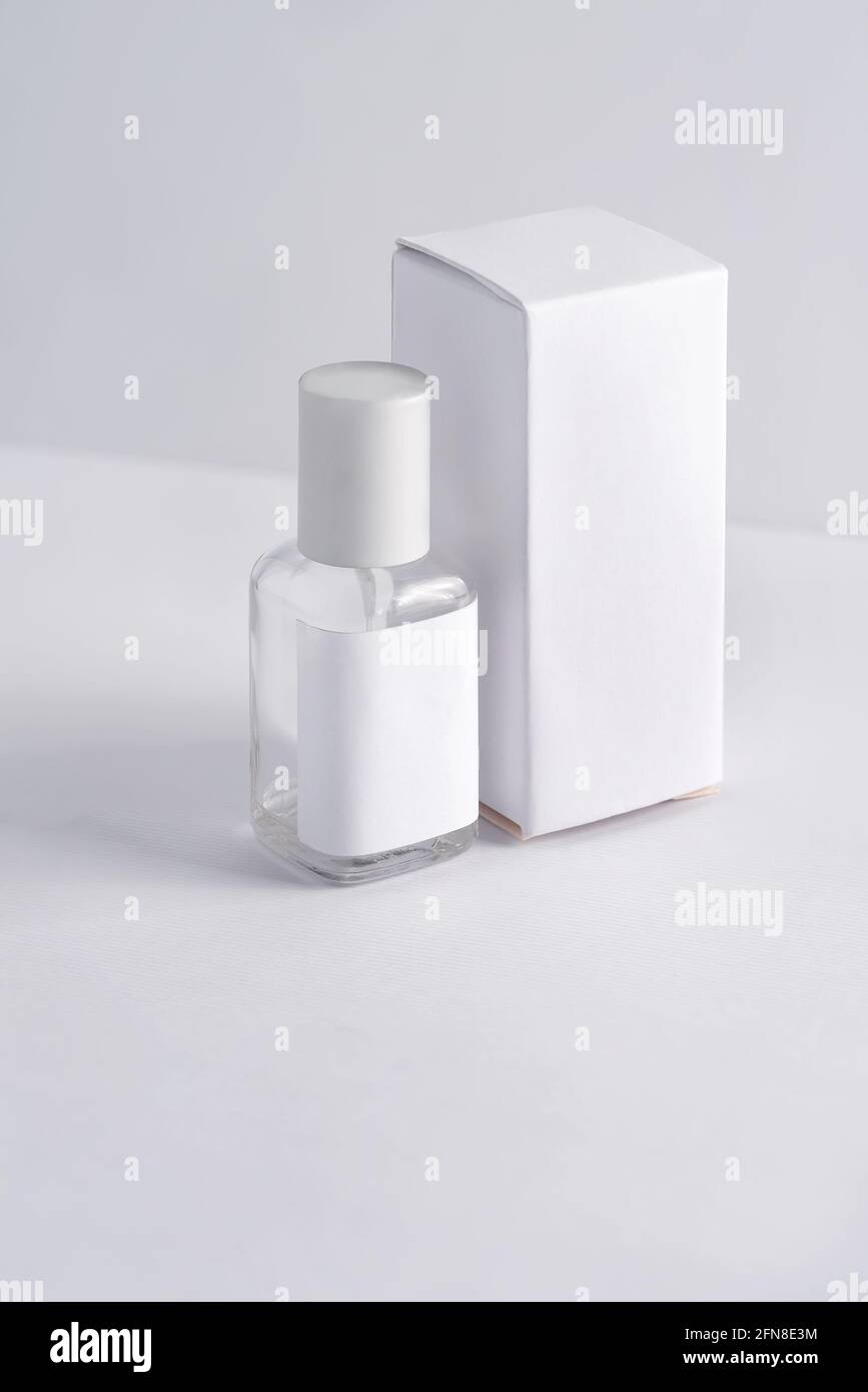 glass product package Perfume bottle and white gift box Stock Photo - Alamy