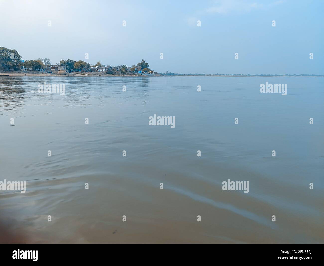 river with light blue sky view background Stock Photo - Alamy