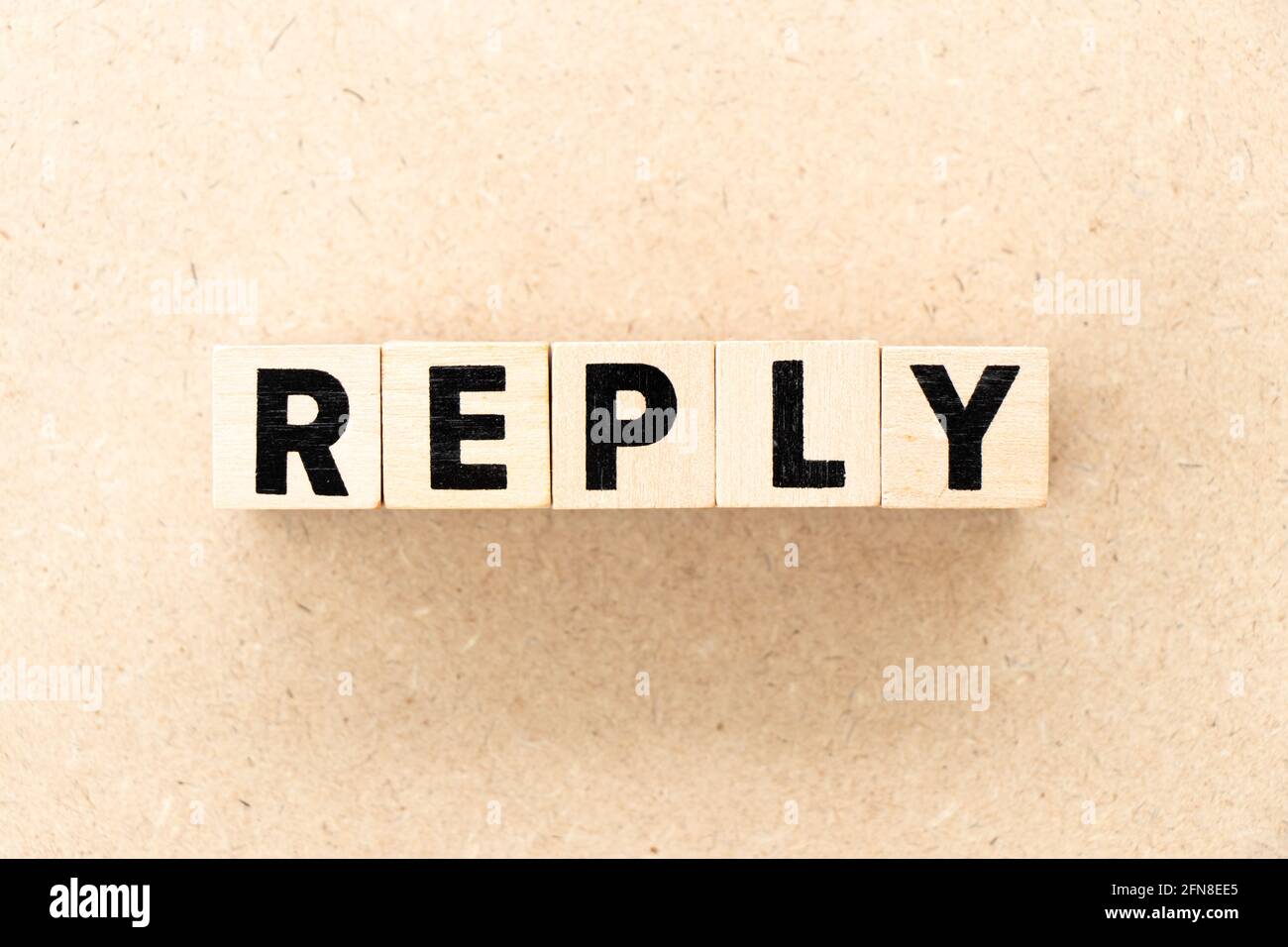 Alphabet letter block in word reply on wood background Stock Photo - Alamy