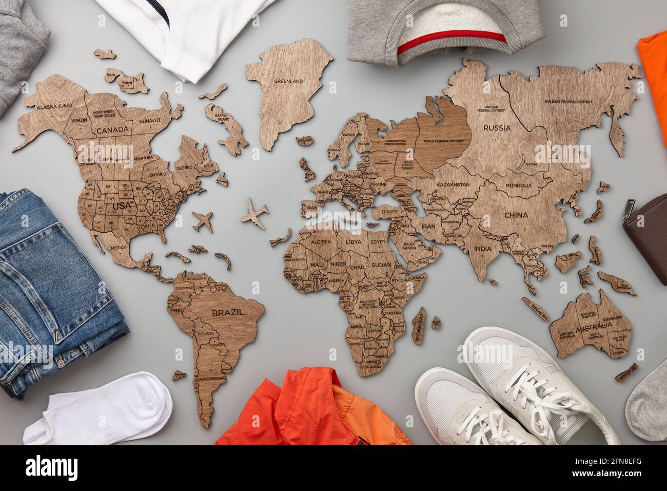Travel concept with world map and clothes Stock Photo - Alamy
