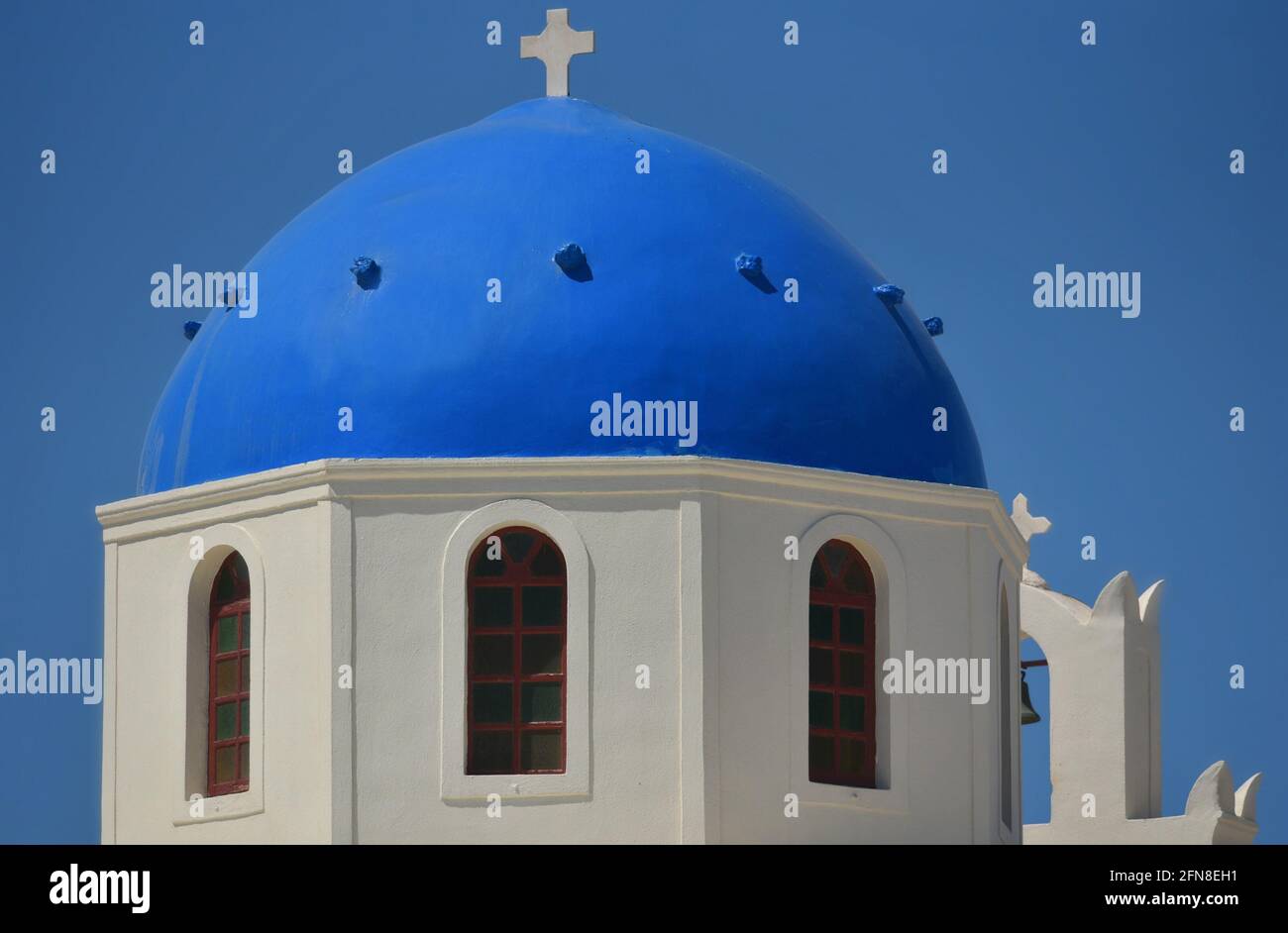 Scenic view of a Greek Orthodox church blue dome with arched windows ...