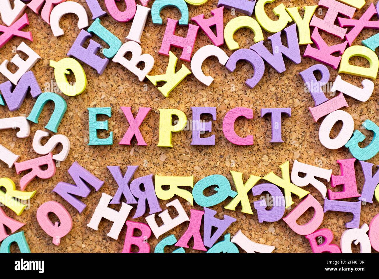 Color alphabet in word expect with another letter as frame on cork ...