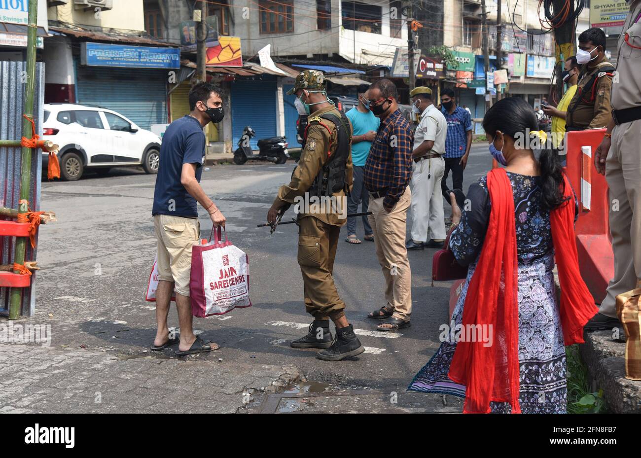 Guwahati, Assam, India. 15th May, 2021. Security personnel stop people from entering inside the ...