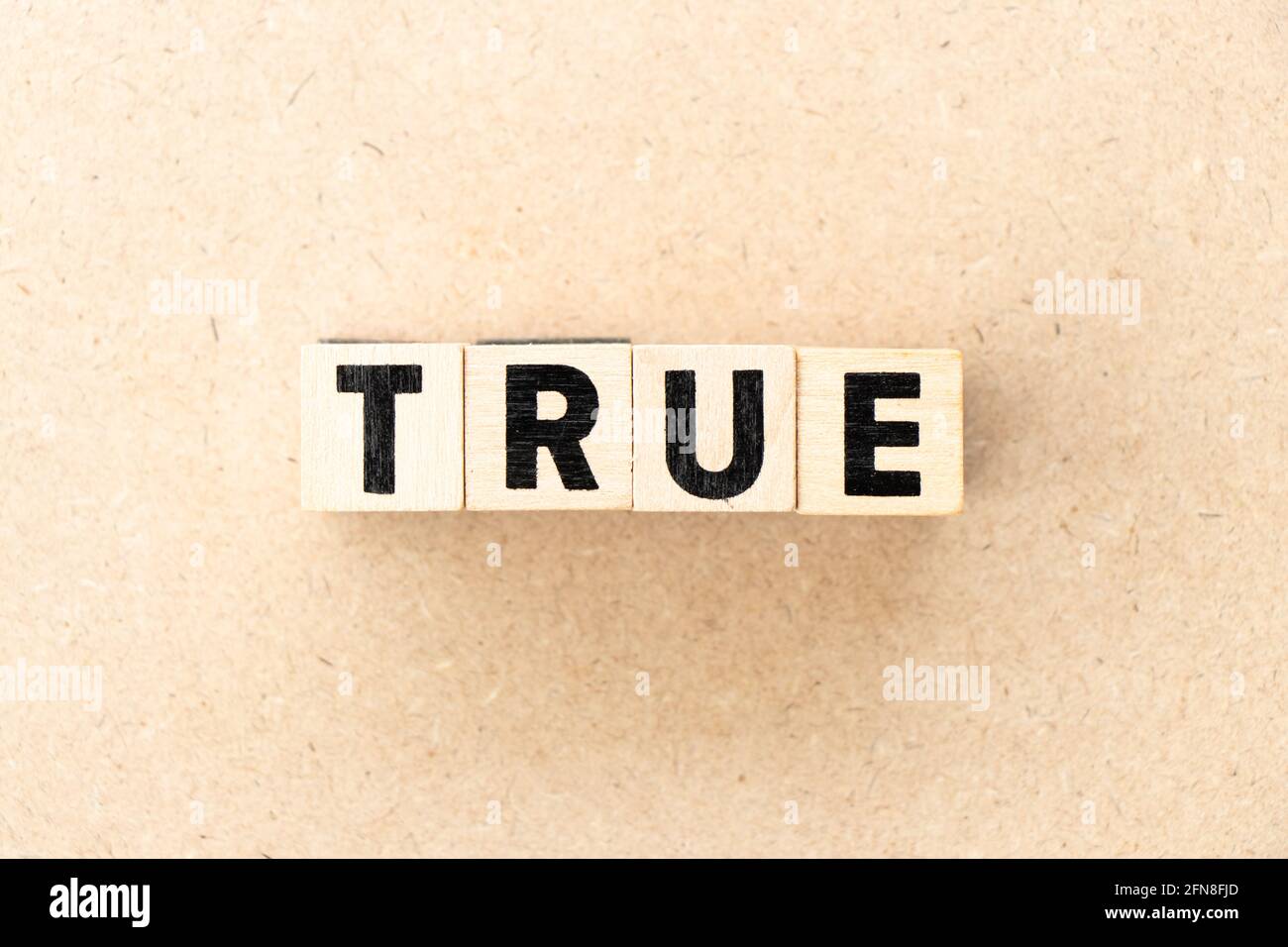 Alphabet letter block in word true on wood background Stock Photo - Alamy