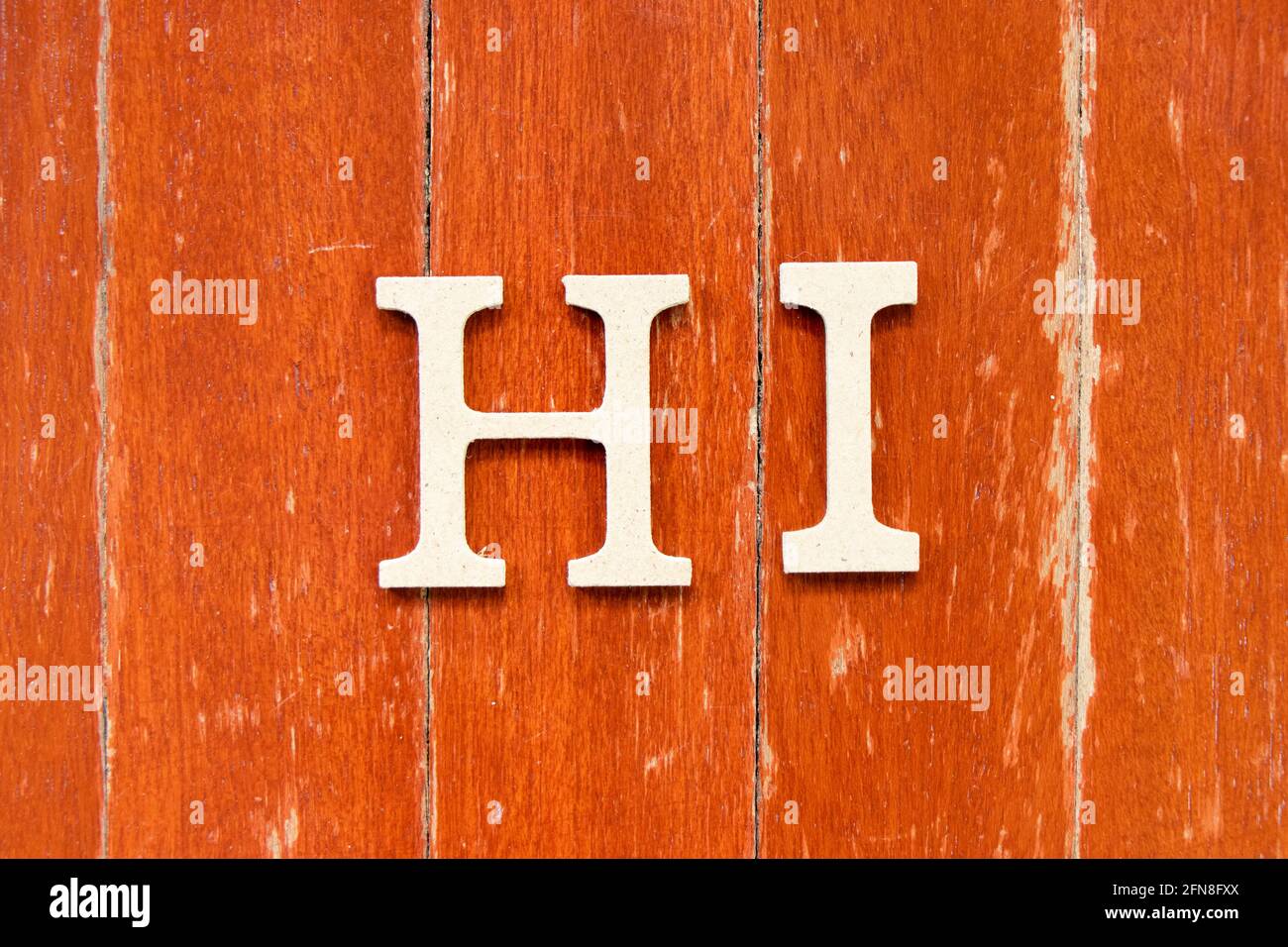 Alphabet letter in word hi on old red color wood plate background Stock ...