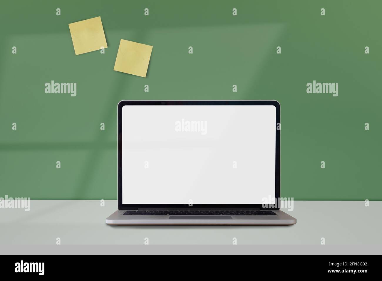 Minimal workspace with mock up laptop computer blank screen on pastel ...