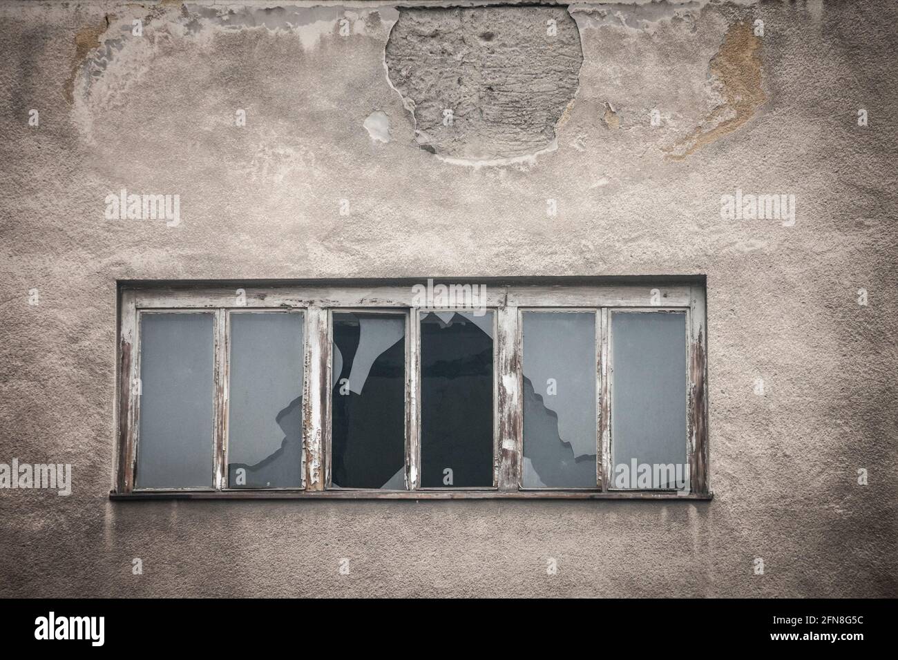 Picture of an old window with broken glass taken on an old industrial ...
