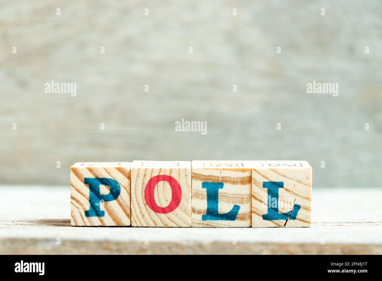 Alphabet letter block in word poll on wood background Stock Photo - Alamy