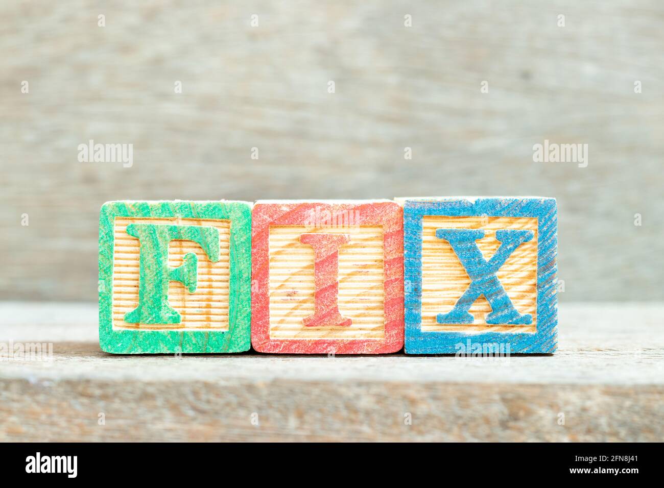 Color alphabet letter block in word fix on wood background Stock Photo ...