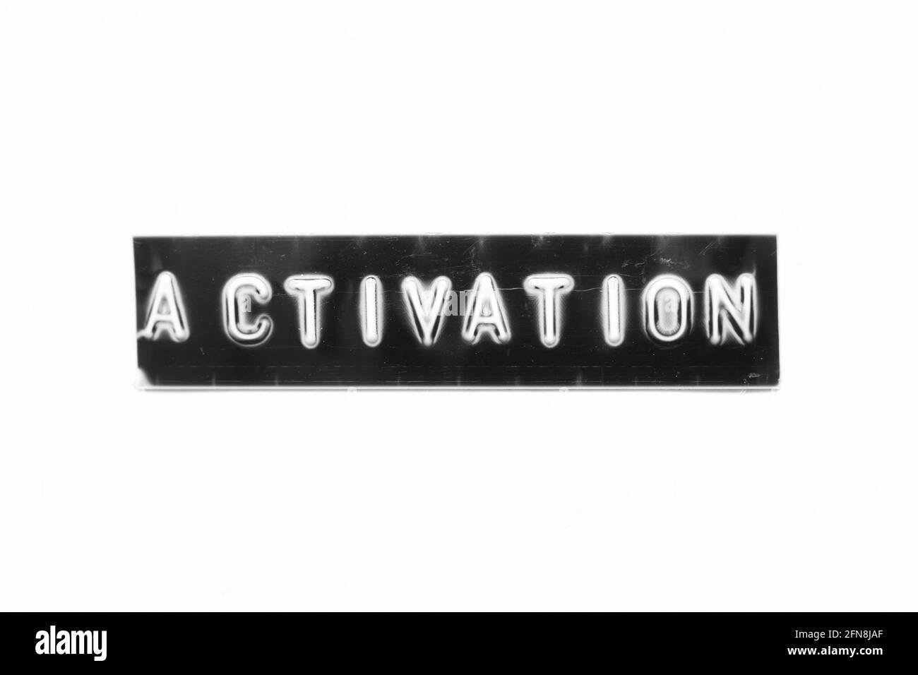 Embossed letter with word activation in black banner on white paper ...