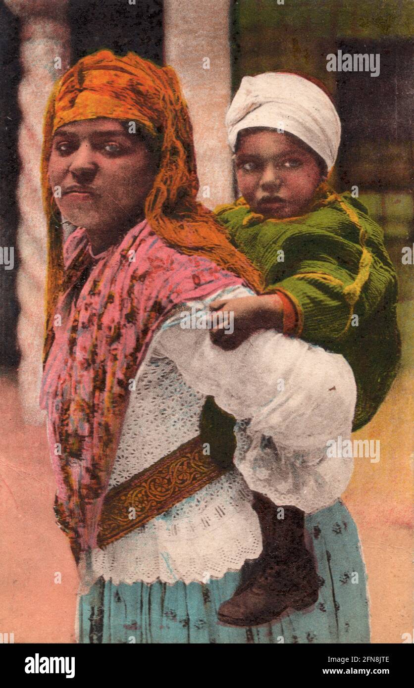 Mother and child, Tangier, 1932. Moroccan woman carrying her baby Stock ...