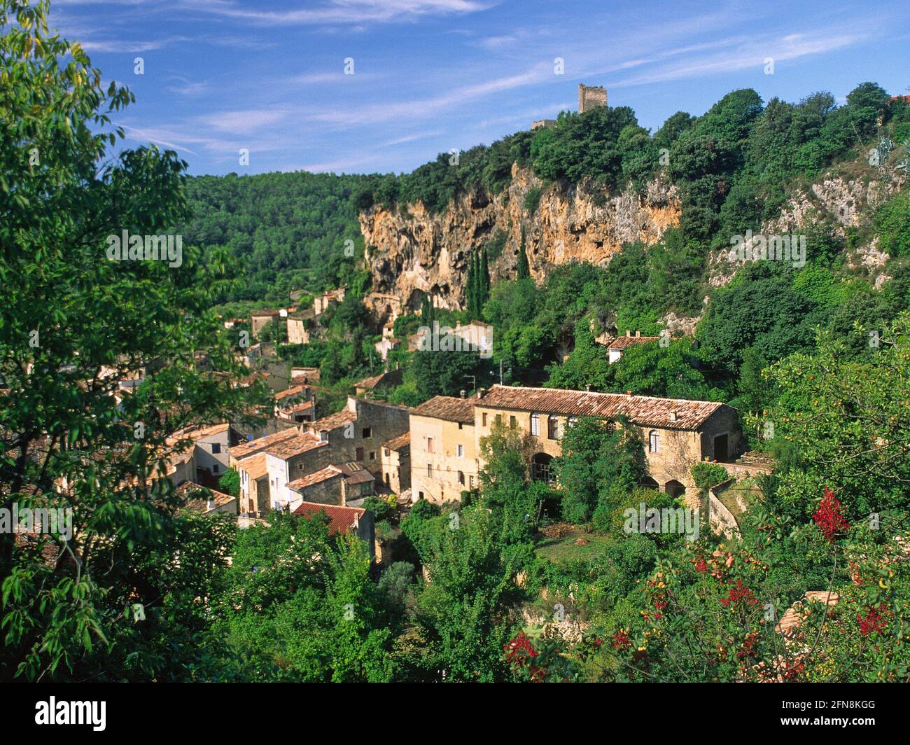 Typical village of Cotignac built under a cliff Stock Photo - Alamy
