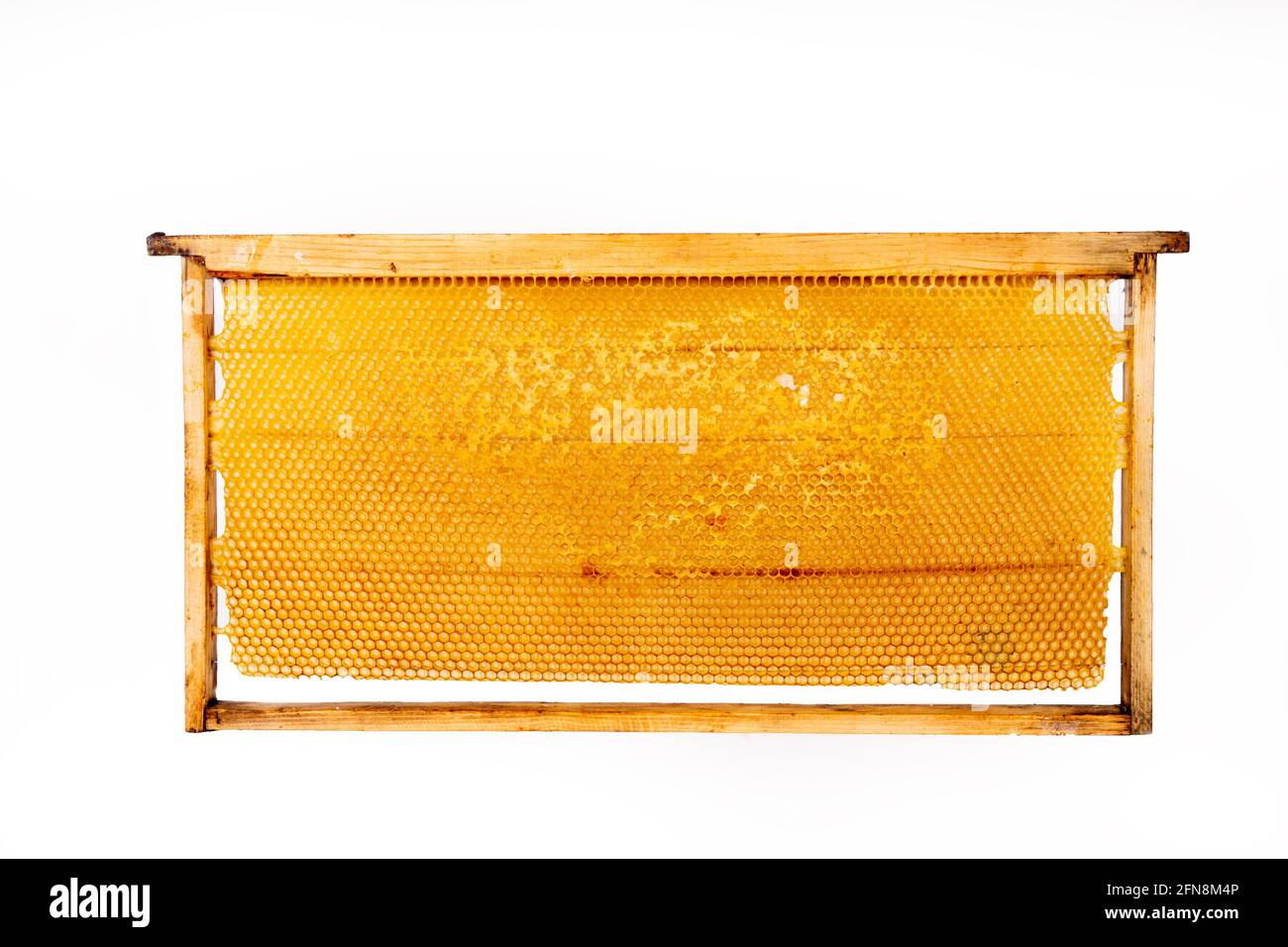 Bee frame with honeycombs on white background Stock Photo - Alamy
