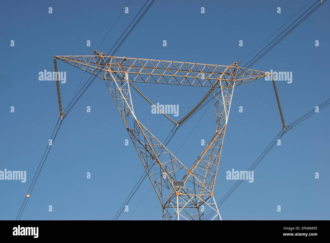 Electric energy transmission by high voltage power lines Stock Photo ...