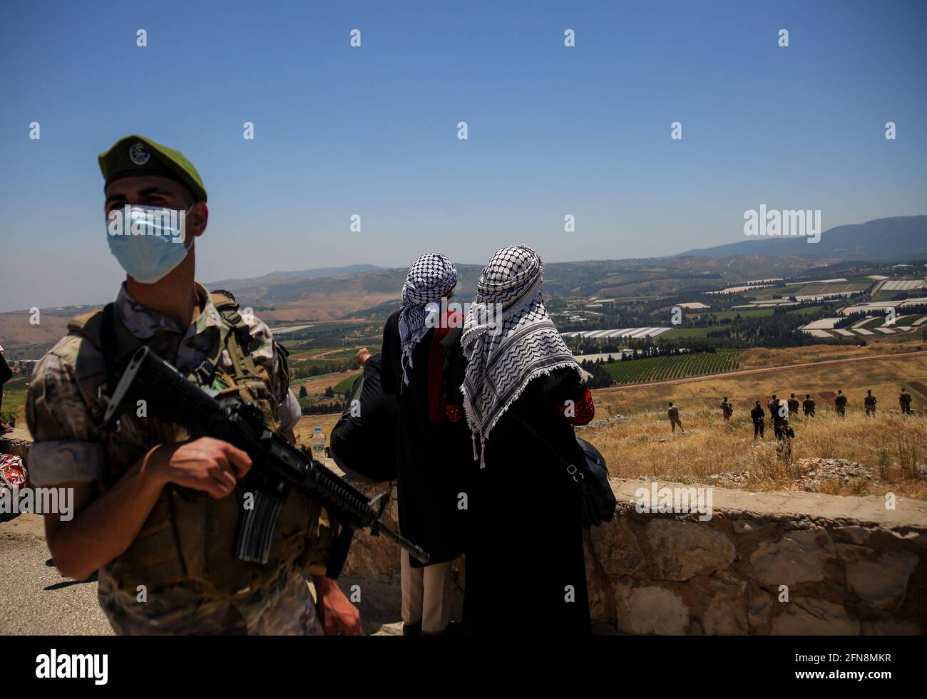 Maroun Al Ras, Lebanon. 15th May, 2021. A Lebanese soldier stands as ...