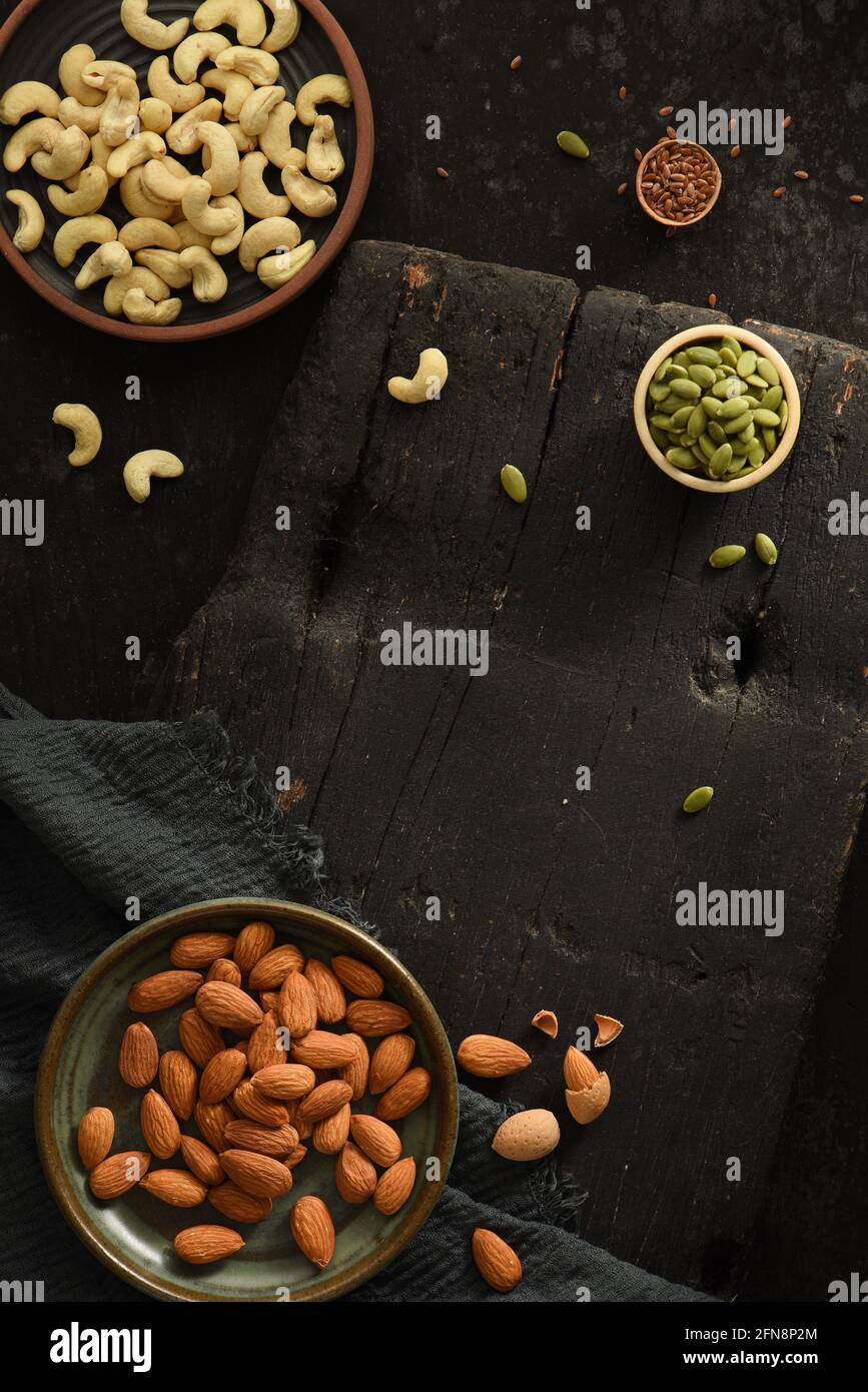 Dark Black Dry Nuts Almond Peanuts Cashewin Bowl Food Flat Lay with ...