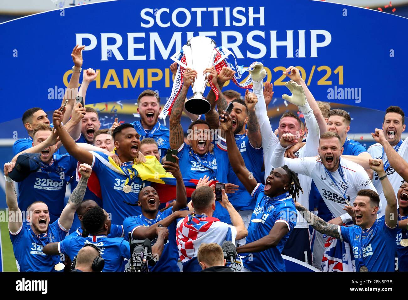 Rangers' James Tavernier lifts the trophy as he celebrates winning the ...