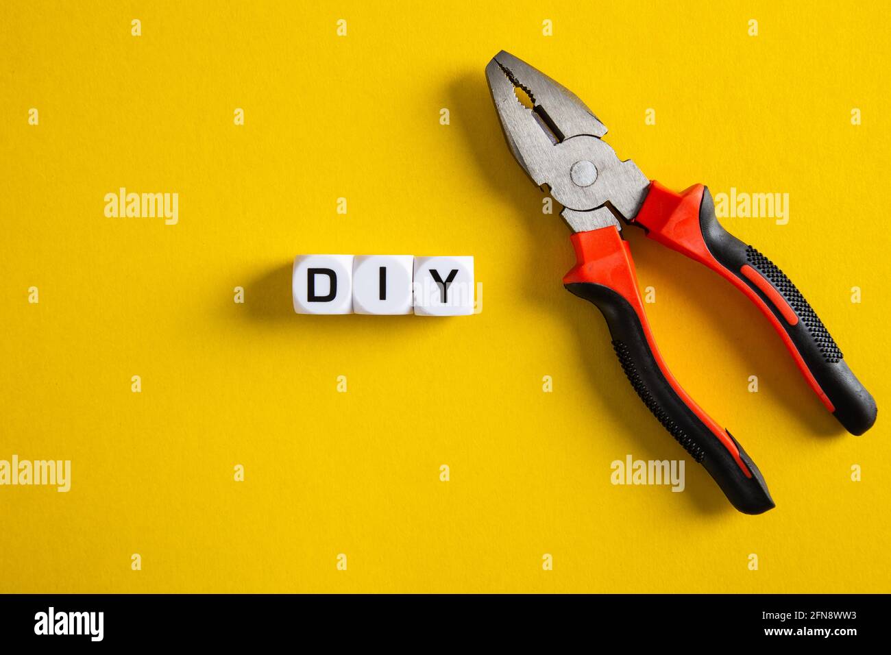 DIY concept. Block with DIY word on yellow background Stock Photo - Alamy