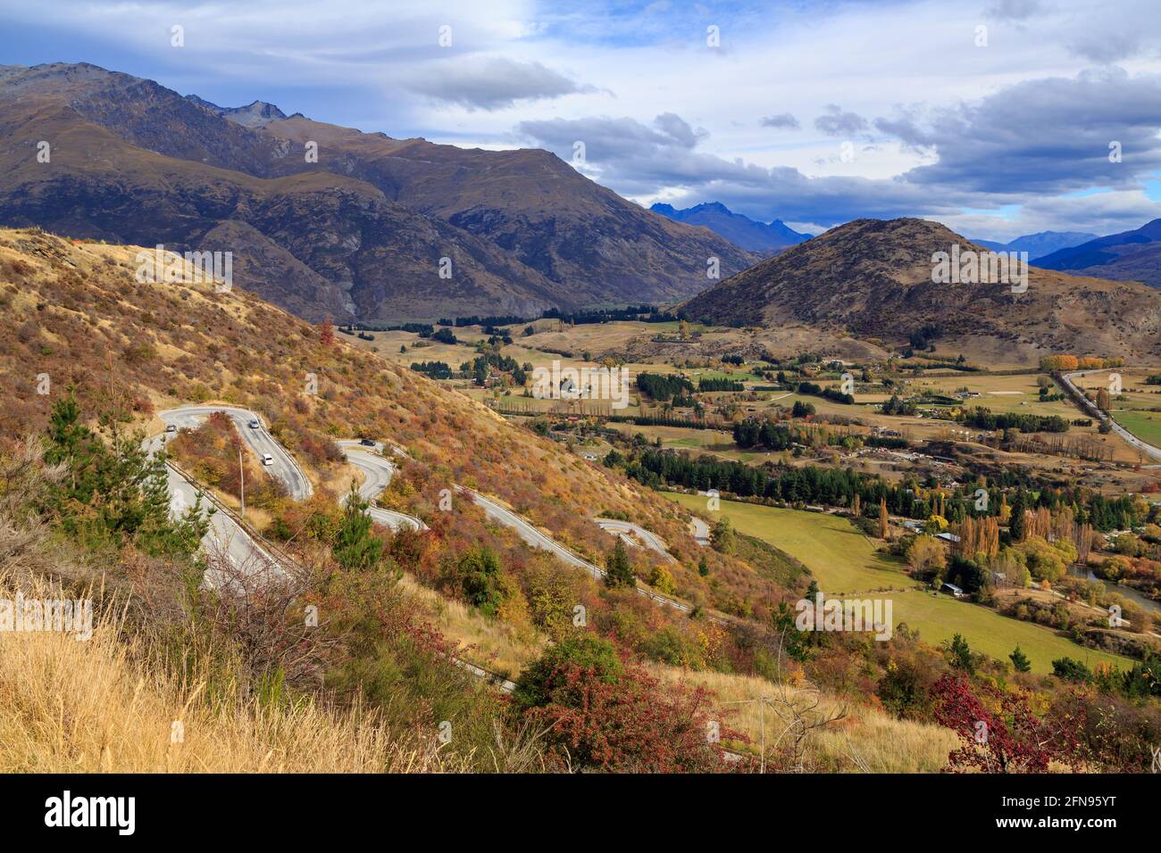 The steep, winding road up the Crown Range near Queenstown, New Zealand ...