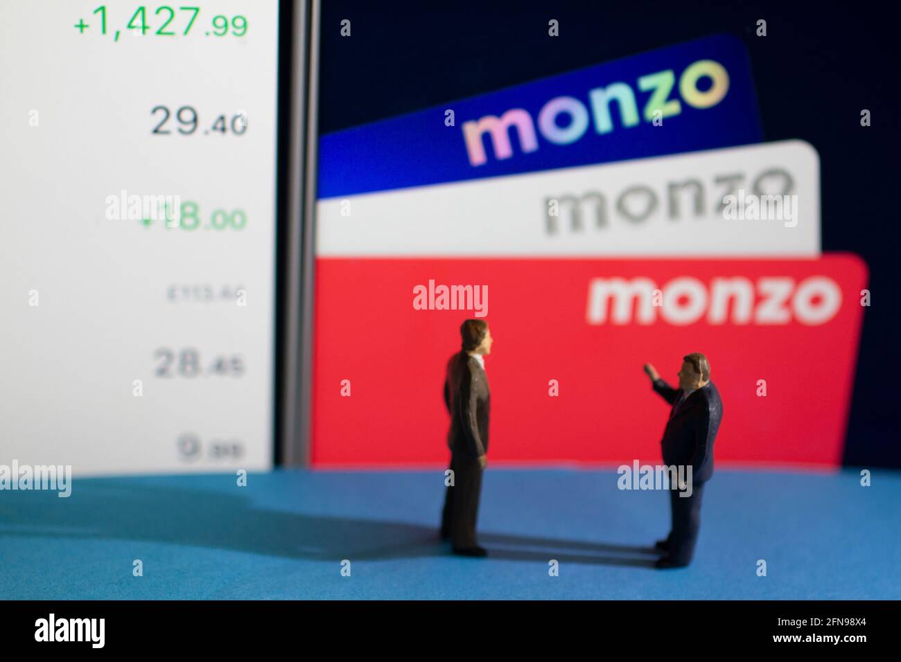 set up of models in front of website of Monzo bank, Monzo Bank Ltd, is ...