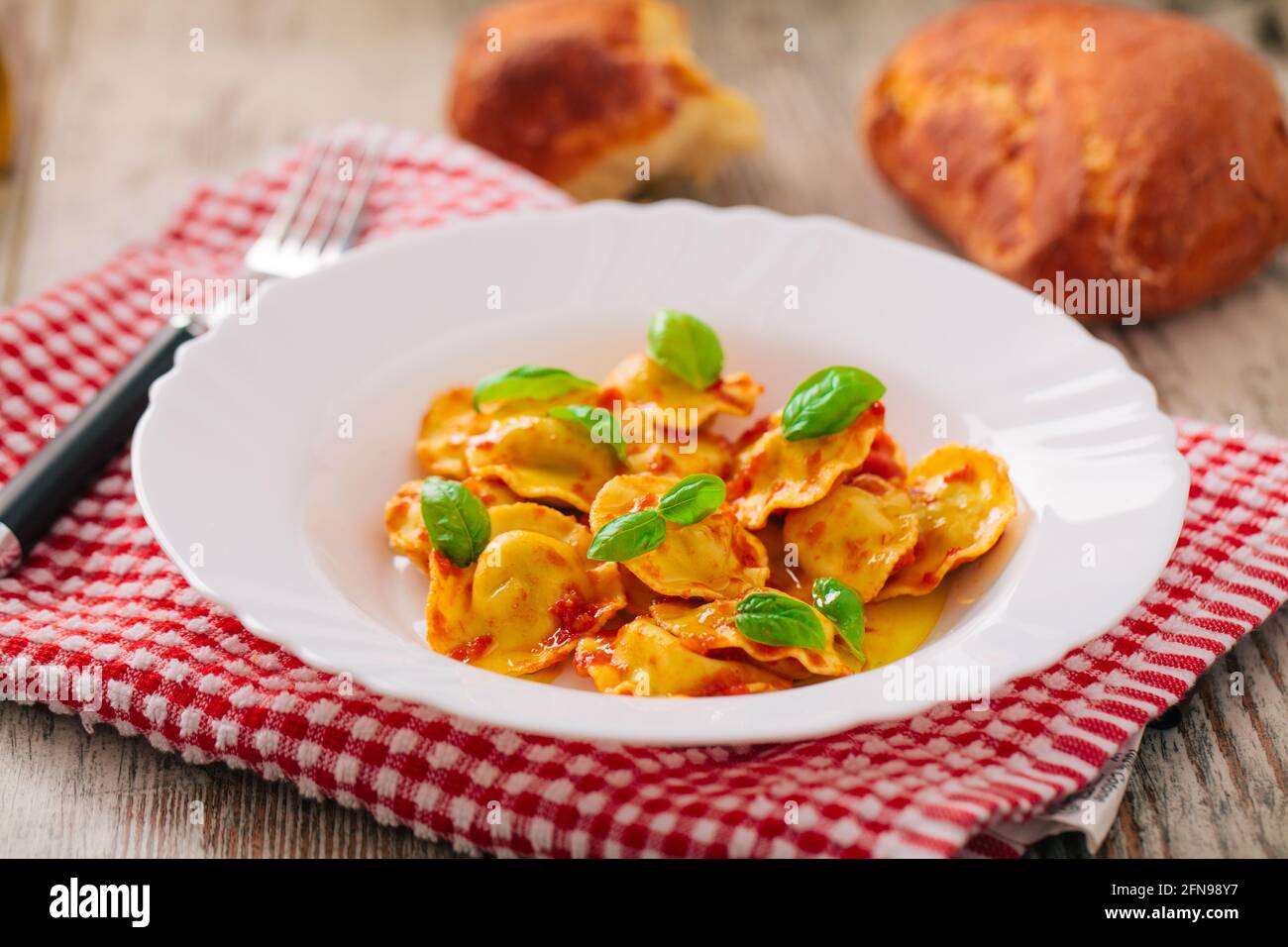 Ravioli with tomato sauce. Typical italian dish Stock Photo - Alamy
