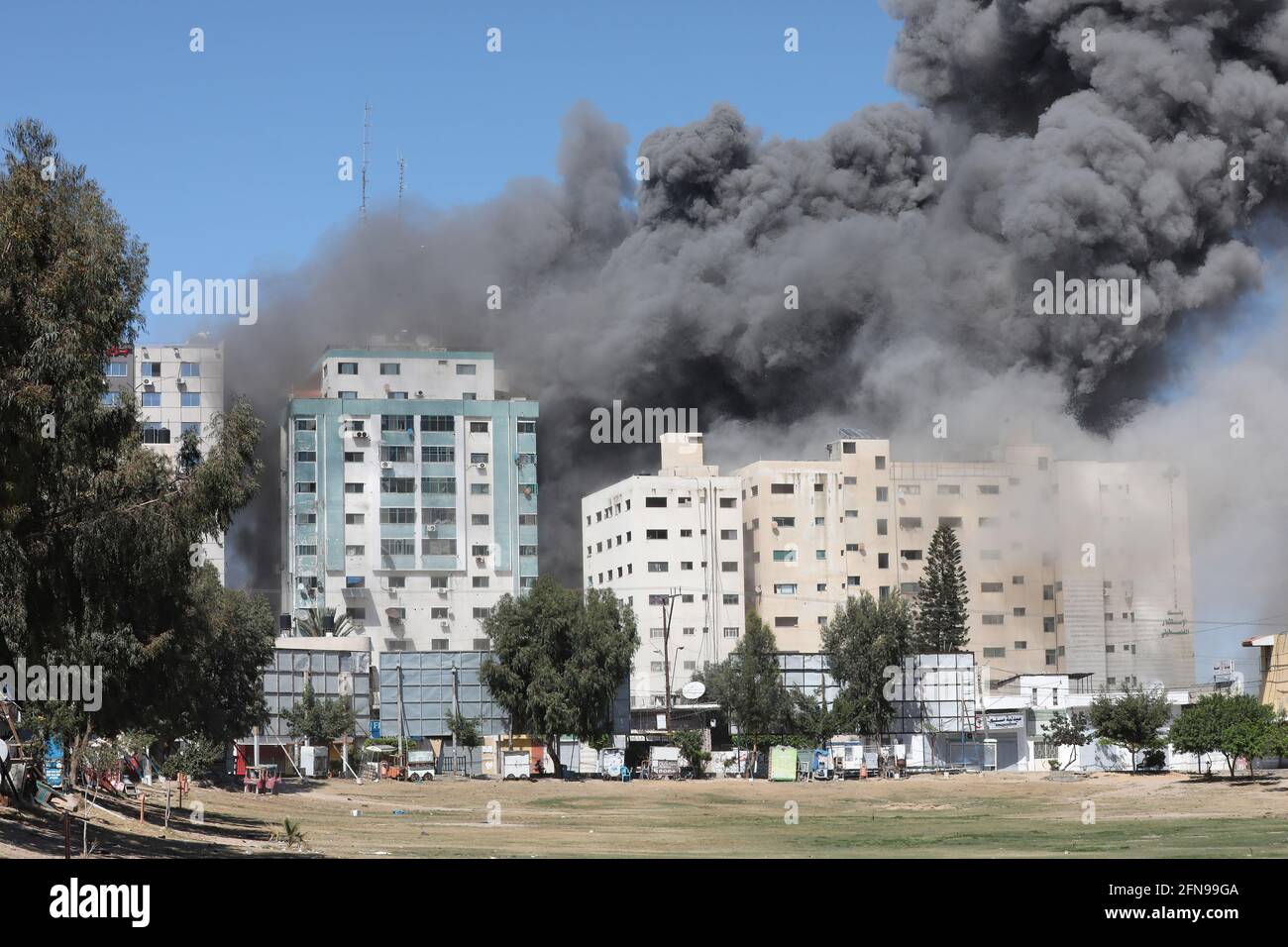 An Israeli airstrike destroys a high-rise building in Gaza City, Gaza ...