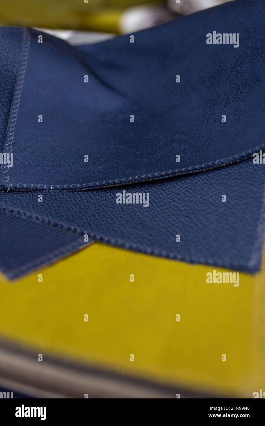 textured fabrics in blue and mustard color are located in the catalog ...