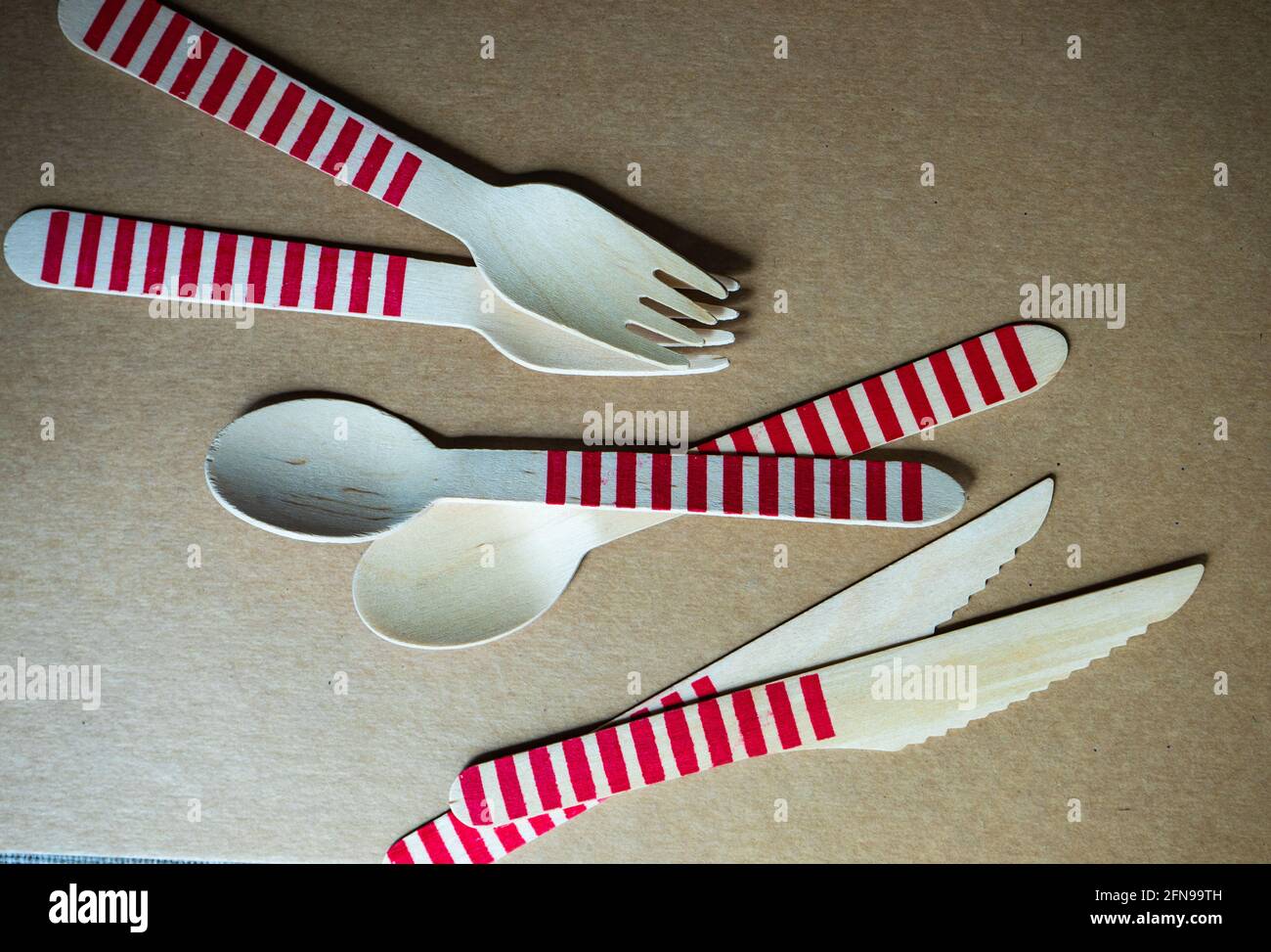 Summer background with wooden recycling cutlery on paper background ...