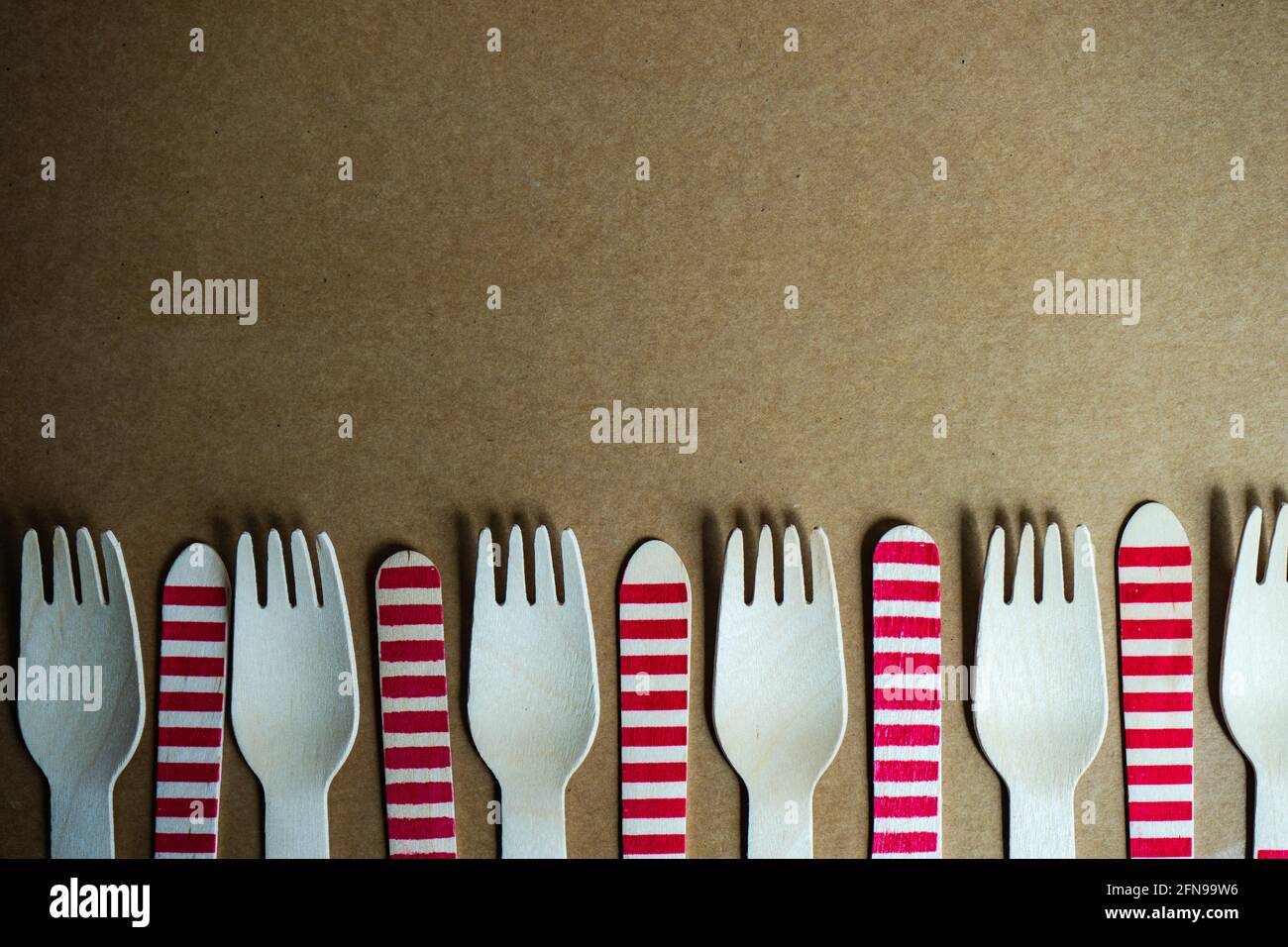 Summer background with wooden recycling cutlery on paper background ...