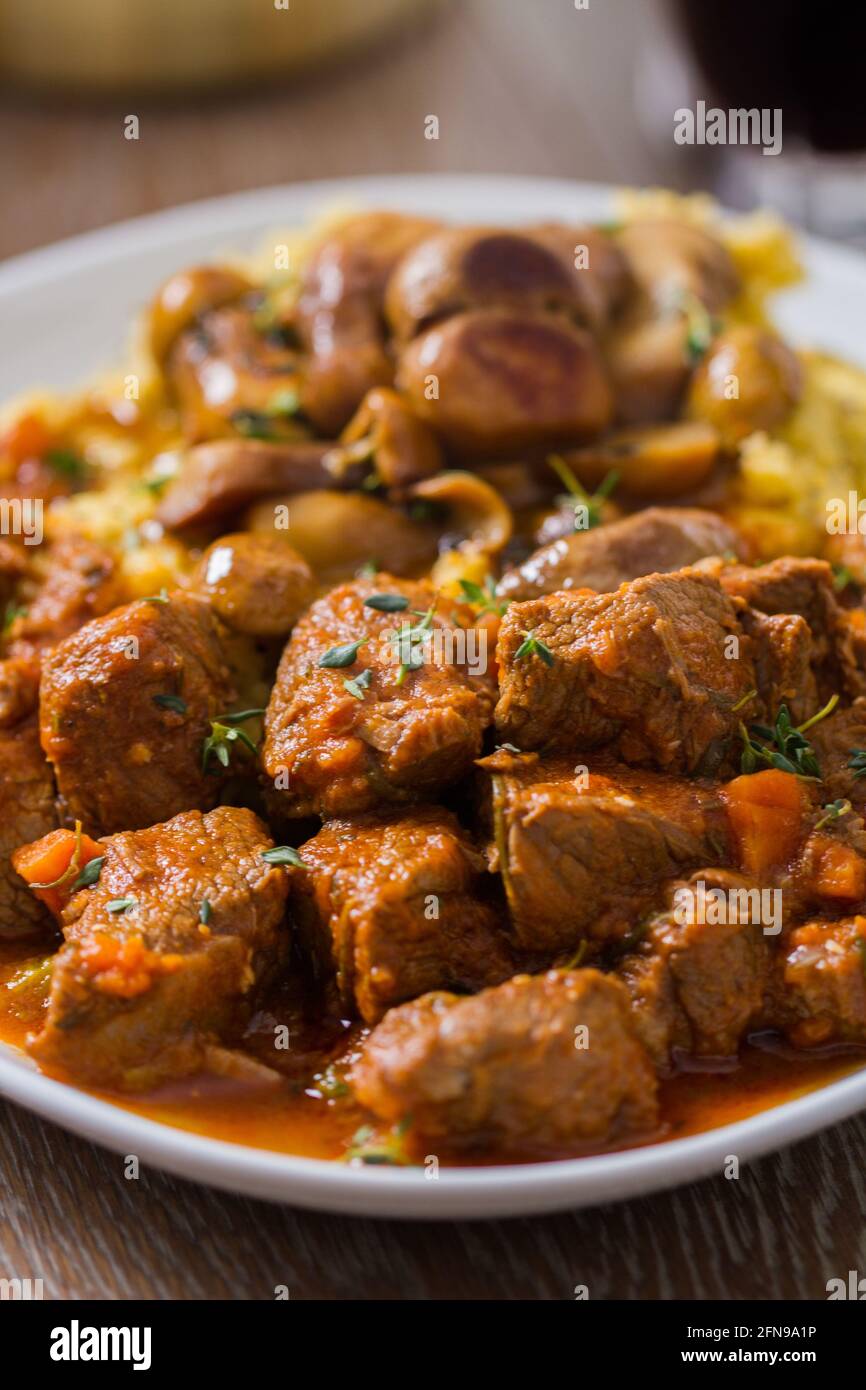 Polenta and beef stew on a plate. High quality photo Stock Photo - Alamy