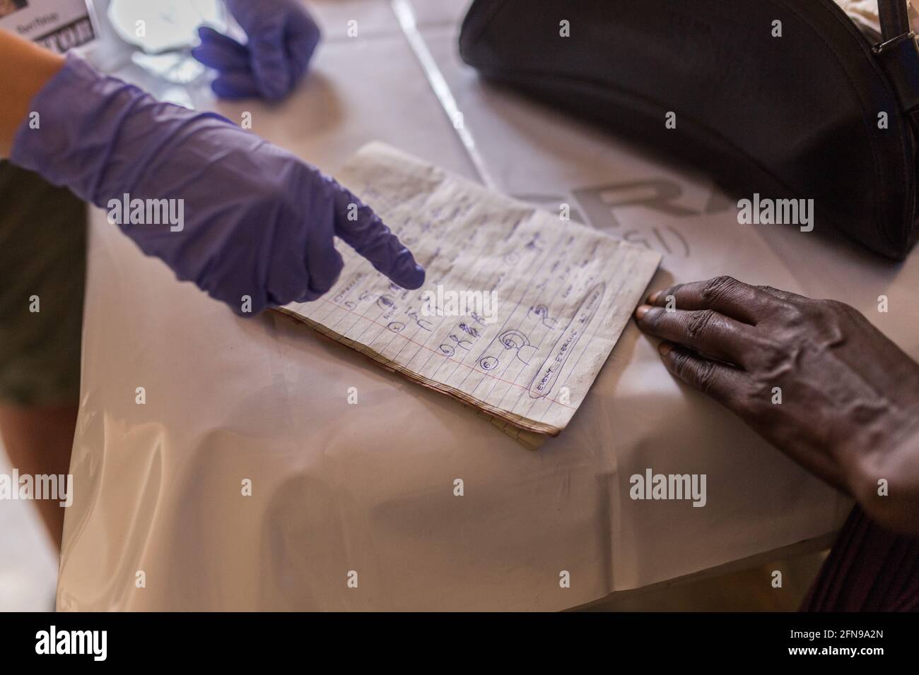Foreign doctor is showing physiotherapy exercises to a patient. in a ...